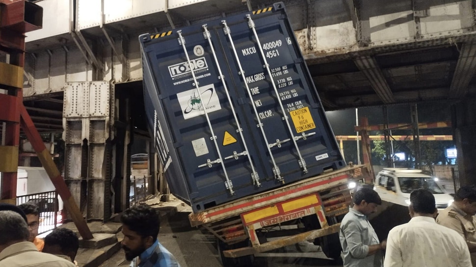Mumbai Sion road container Stuck under the bridge causing Accindent and ...