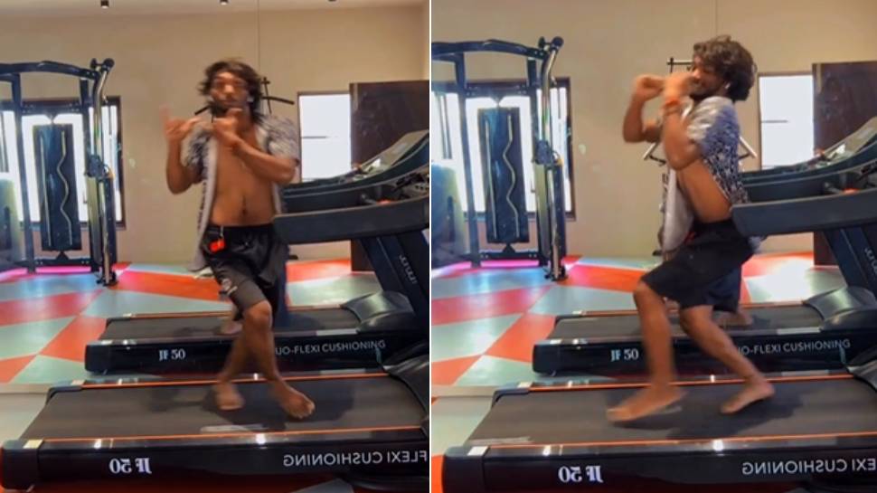 man sizzling dance on the treadmill in the gym